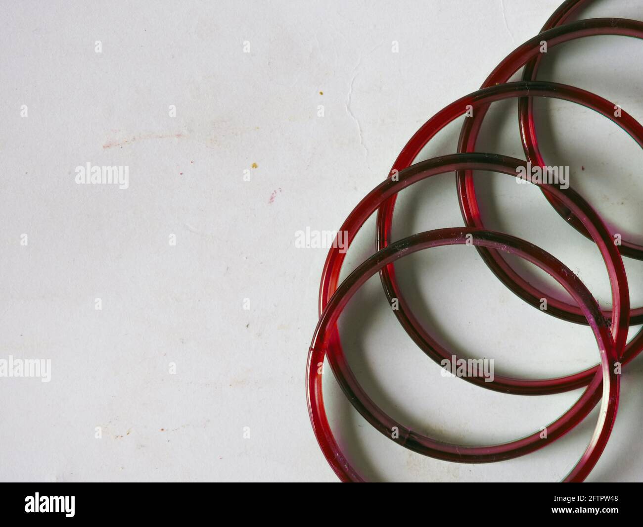 Group of traditional red glass bangles isolated on white background ...