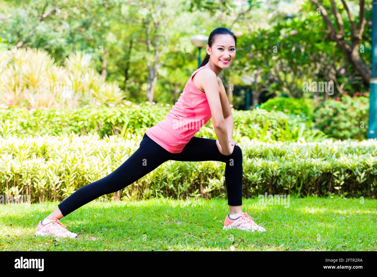 Asian chinese woman stretching hi-res stock photography and images - Alamy