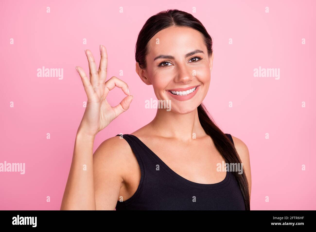 Photo of happy nice pretty young woman show okay sign recommend ...