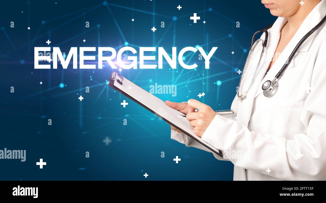 Doctor fills out medical record Stock Photo - Alamy