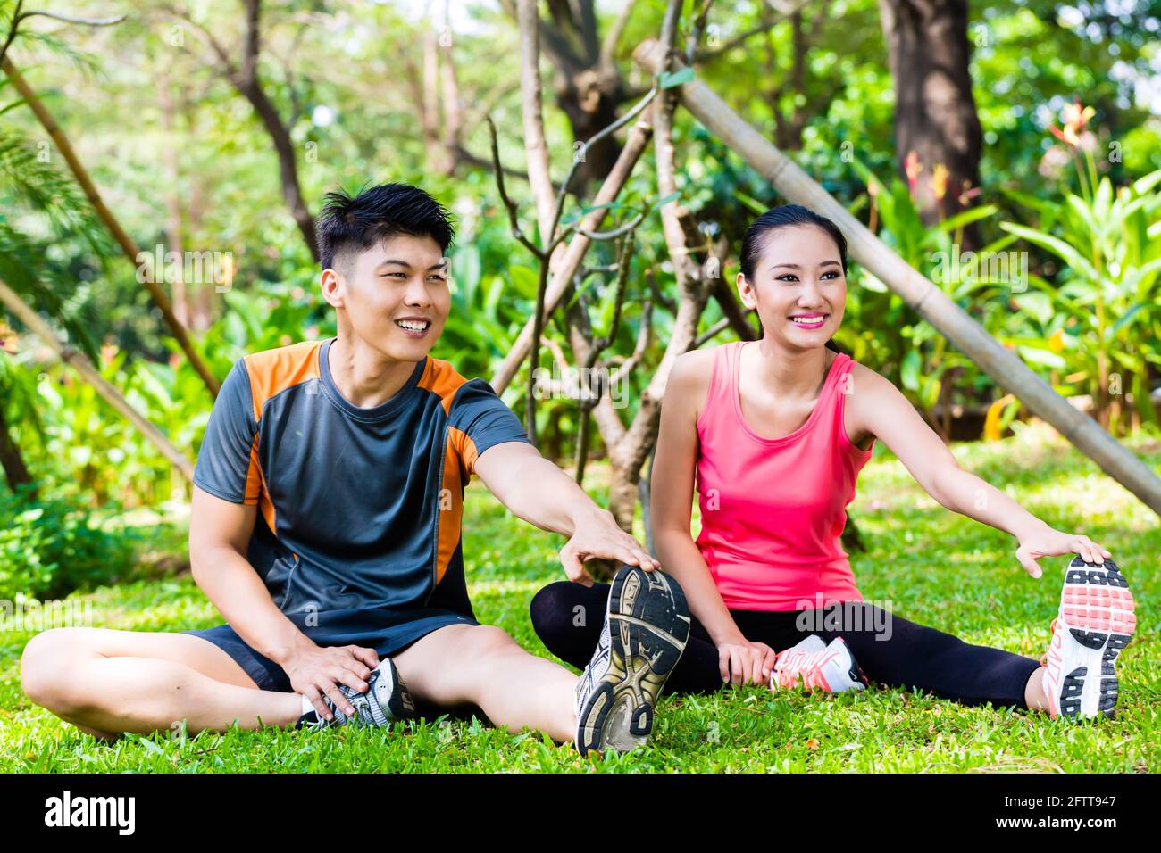 Young chinese man stretching hi-res stock photography and images - Alamy