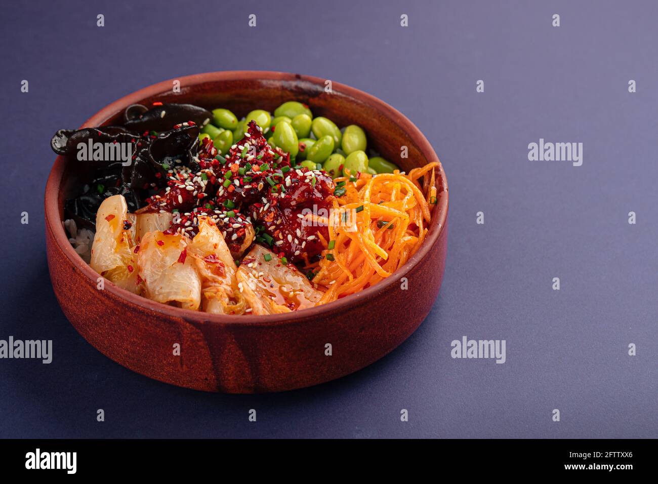 Hawaiian spicy chicken poke bowl with kimchi Stock Photo - Alamy