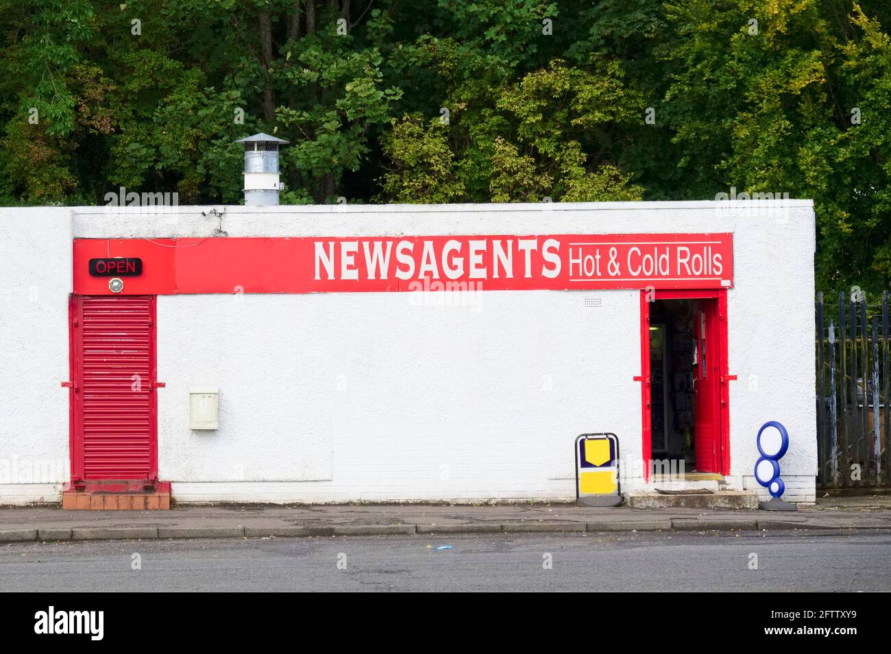 Shop front with blank sign and closed shutter door Stock Photo - Alamy