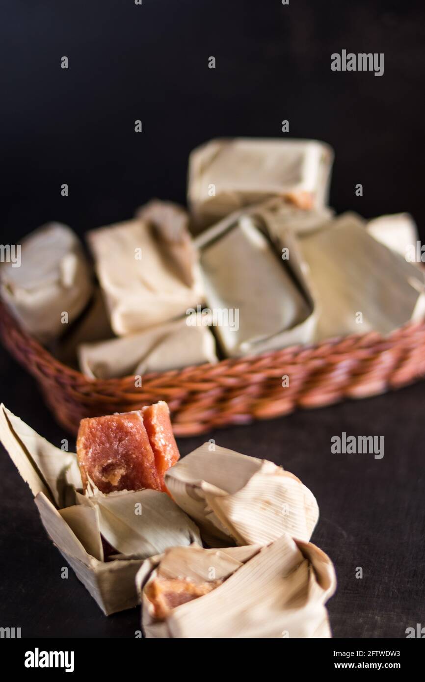 Some red and sweet colombian candy covered with leaves in a little ...