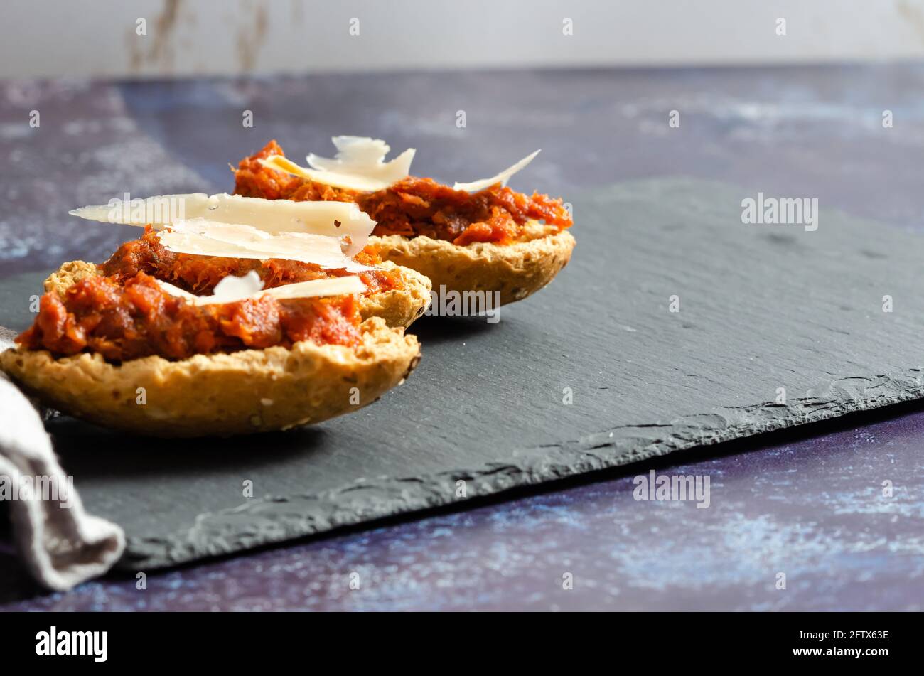 Three toasts with sobrasada and cheese Stock Photo - Alamy