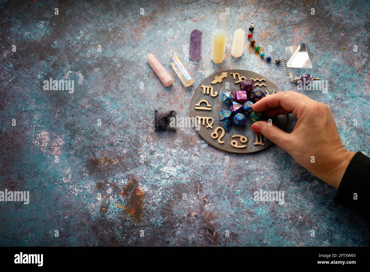 zodiac horoscope symbol with fortune-teller hands and healing crystals ...