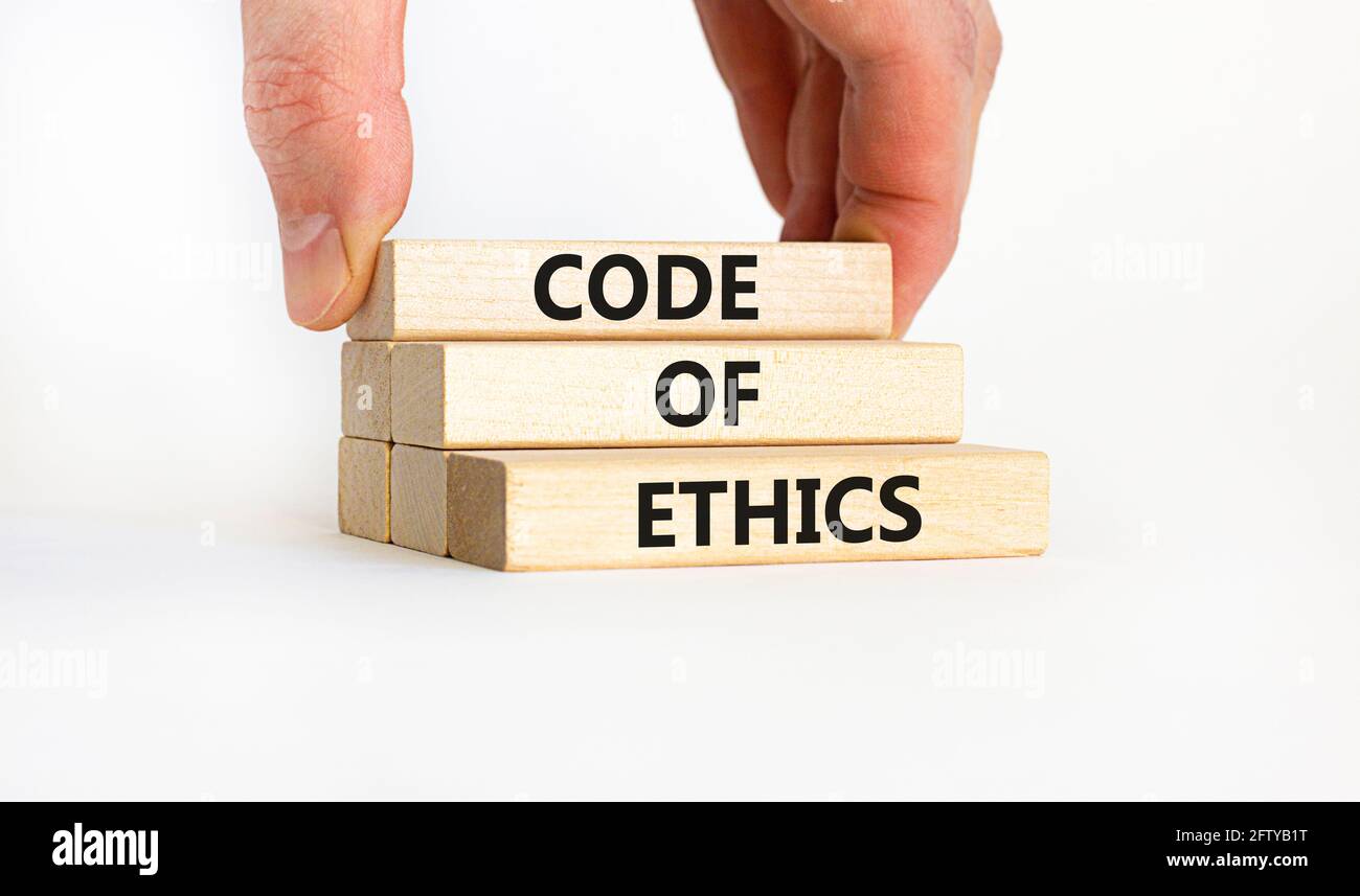 Code of ethics symbol. Concept words 'Code of ethics' on wooden blocks ...