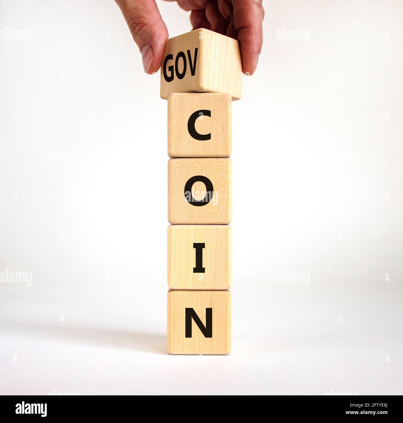 Govcoin symbol. Businessman turns wooden cubes and changes the word ...