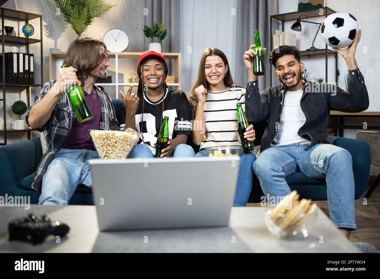 Football laptop fans watching hi-res stock photography and images - Alamy