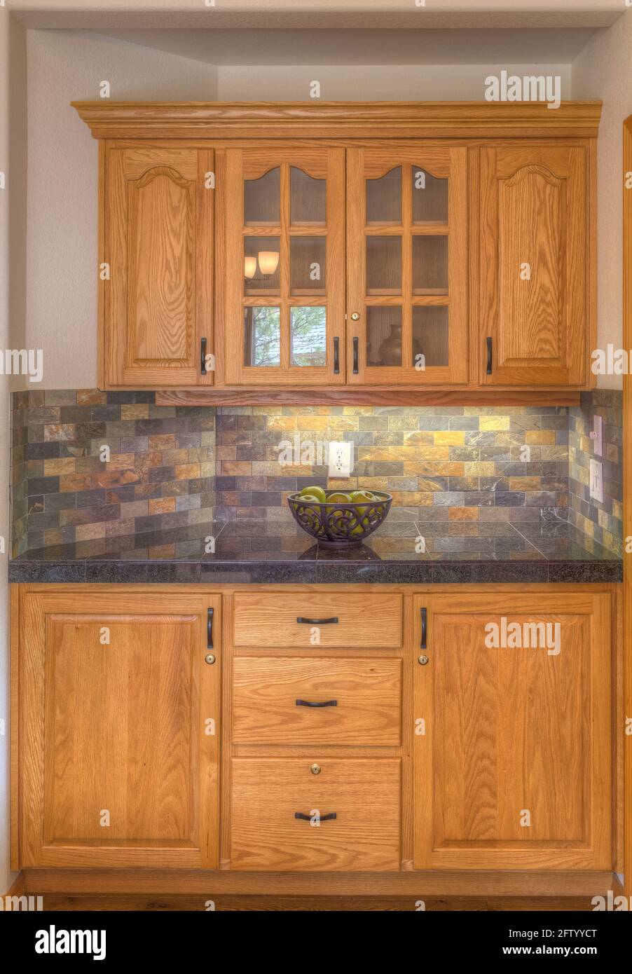 Wooden built in buffet with fruit bowl Stock Photo - Alamy