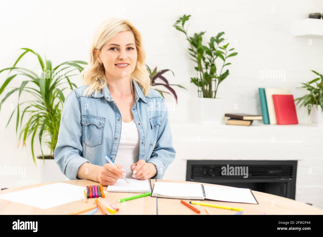 Portrait of a serious female schoolteacher in the classroom Stock Photo ...