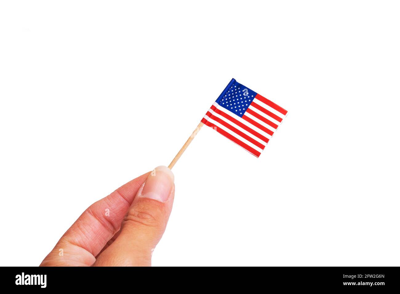 Small american flag in hand isolated on white background close up Stock ...