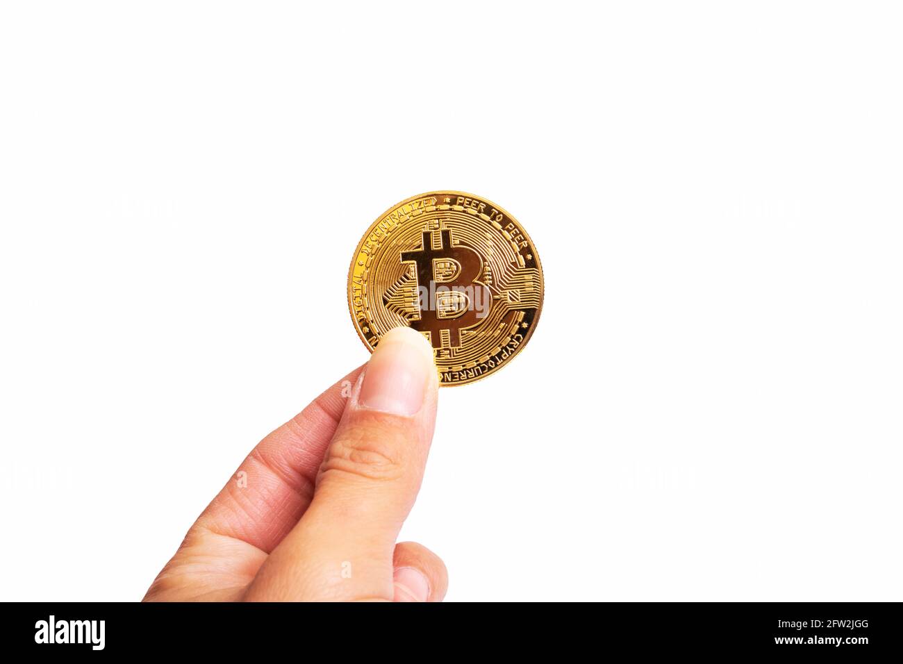 Bitcoin in hand isolated on white background close up Stock Photo - Alamy