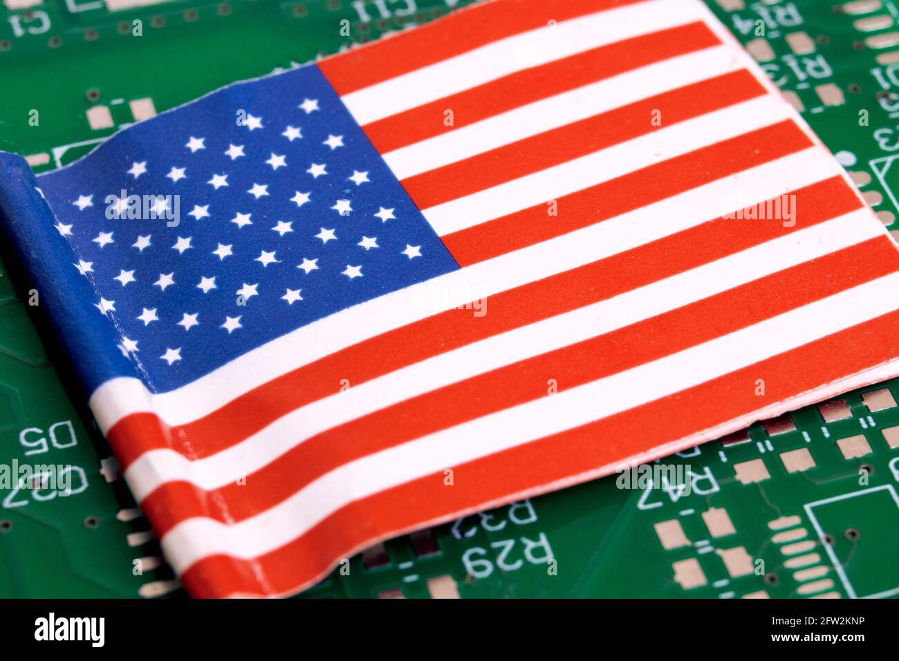 America flag on green circuit board background close up Stock Photo - Alamy