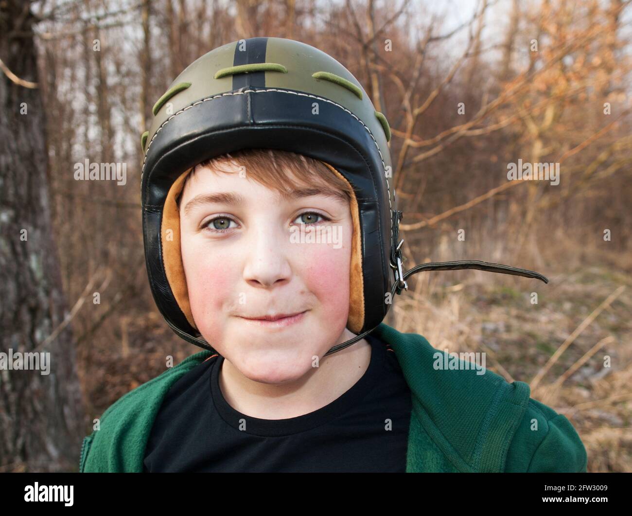 Young boy in army helmet Stock Photo - Alamy