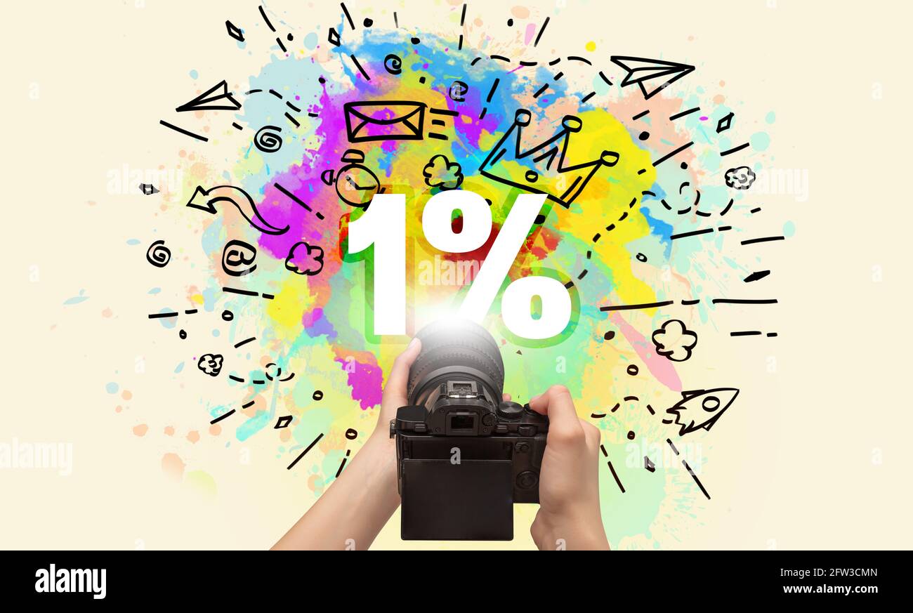 Close-up of a hand holding digital camera with abstract drawing concept ...