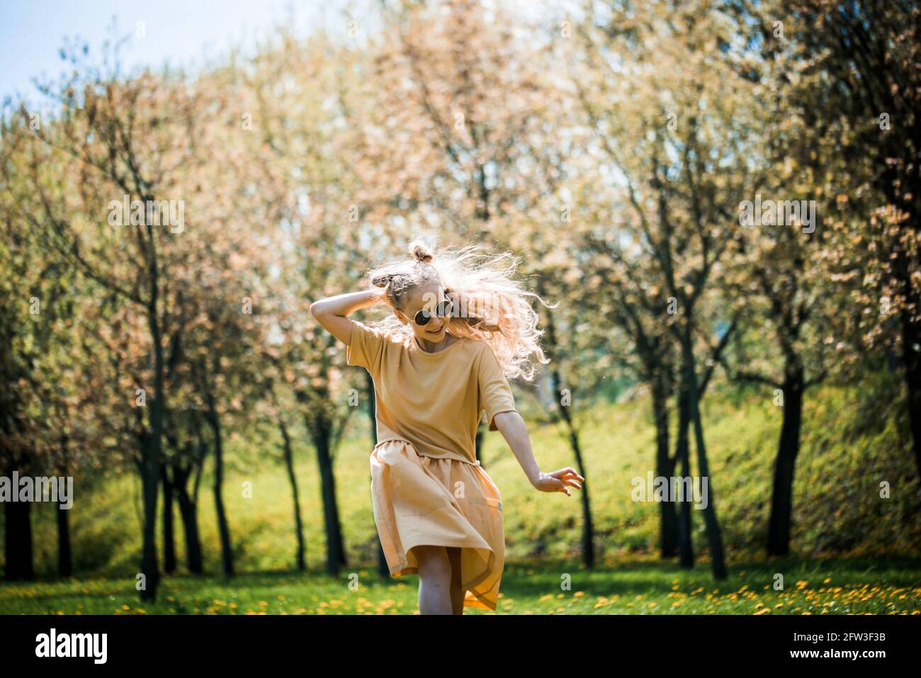 Cute little girl in the park on a sunny summer day, Outdoor summer ...