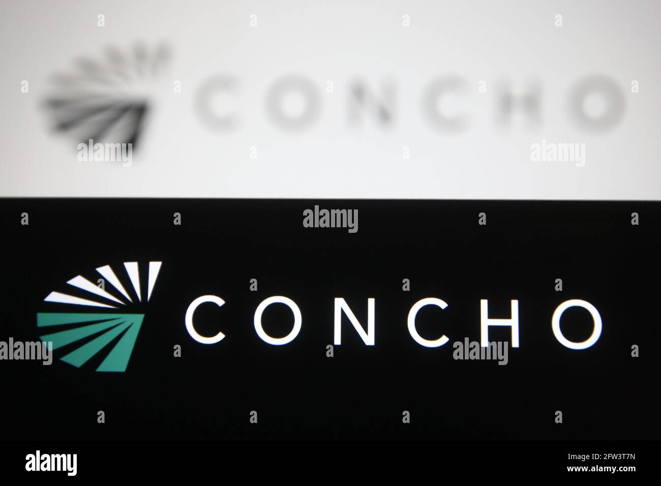 In this photo illustration the Concho Resources logo is seen on a ...