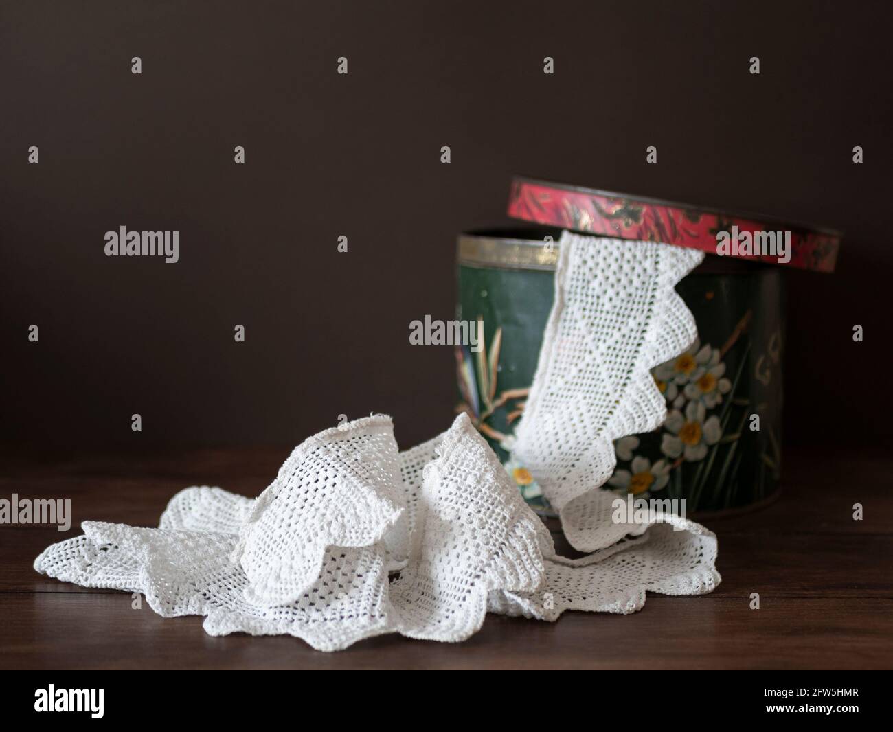 Ribbon of white retro handmade lace taken out of the old metal ...