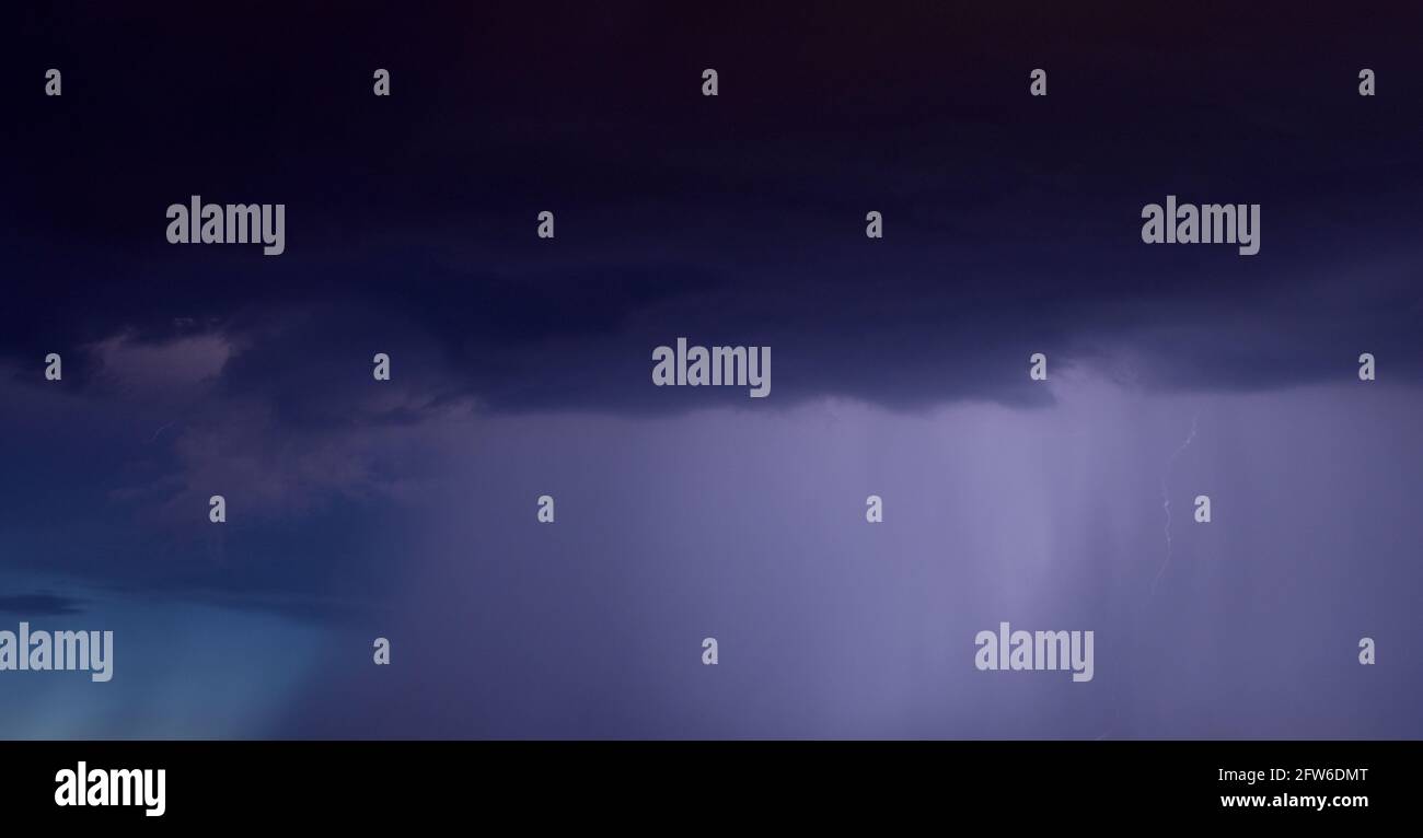 Heavy rain above my city and dark clouds Stock Photo - Alamy