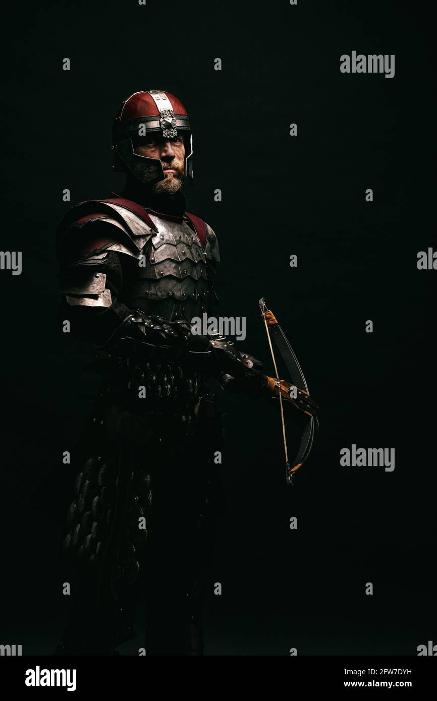 Portrait of a medieval fighter holding a crossbow in his hands Stock ...