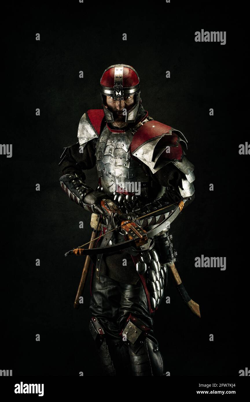 Portrait of a medieval fighter holding a crossbow in his hands Stock ...