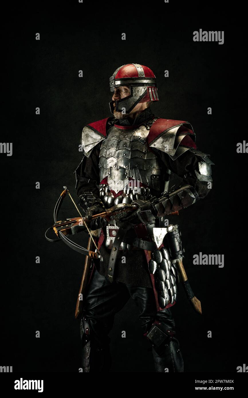 Portrait of a medieval fighter holding a crossbow in his hands Stock ...