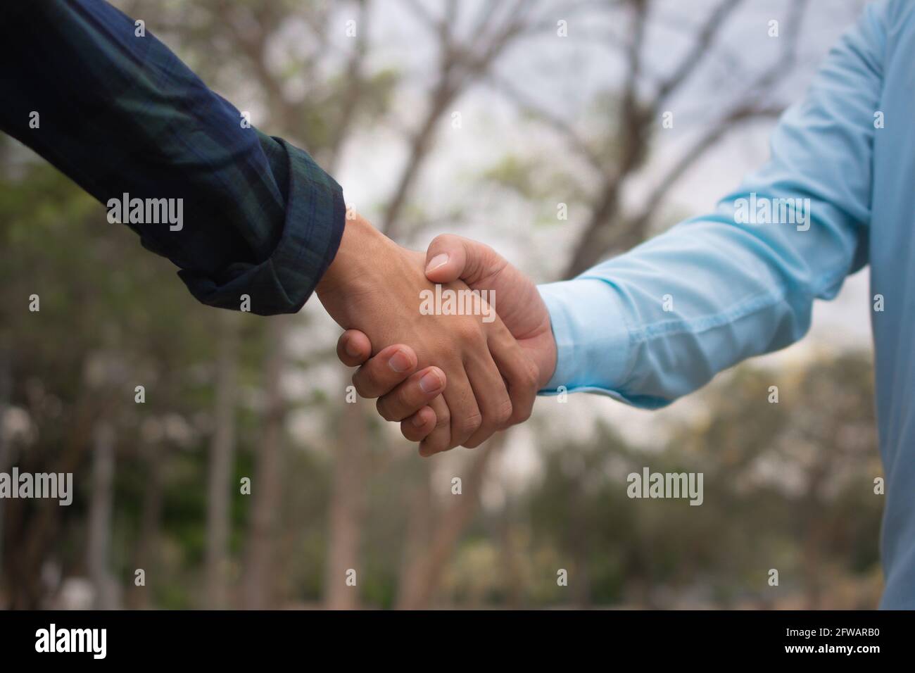 Friends shake hand teamwork partnership , Hand shake concept Stock ...