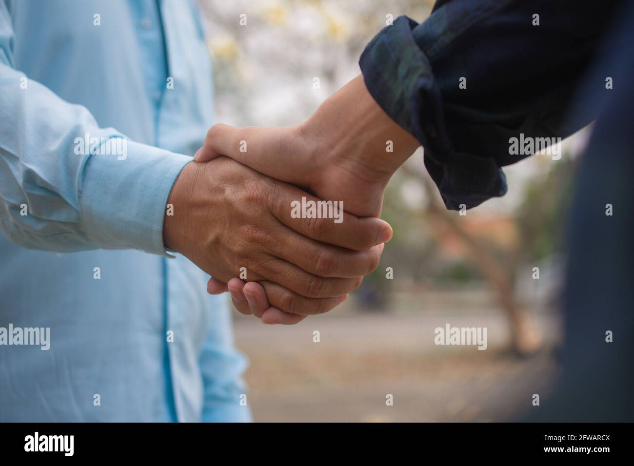 Friends shake hand teamwork partnership , Hand shake concept Stock ...