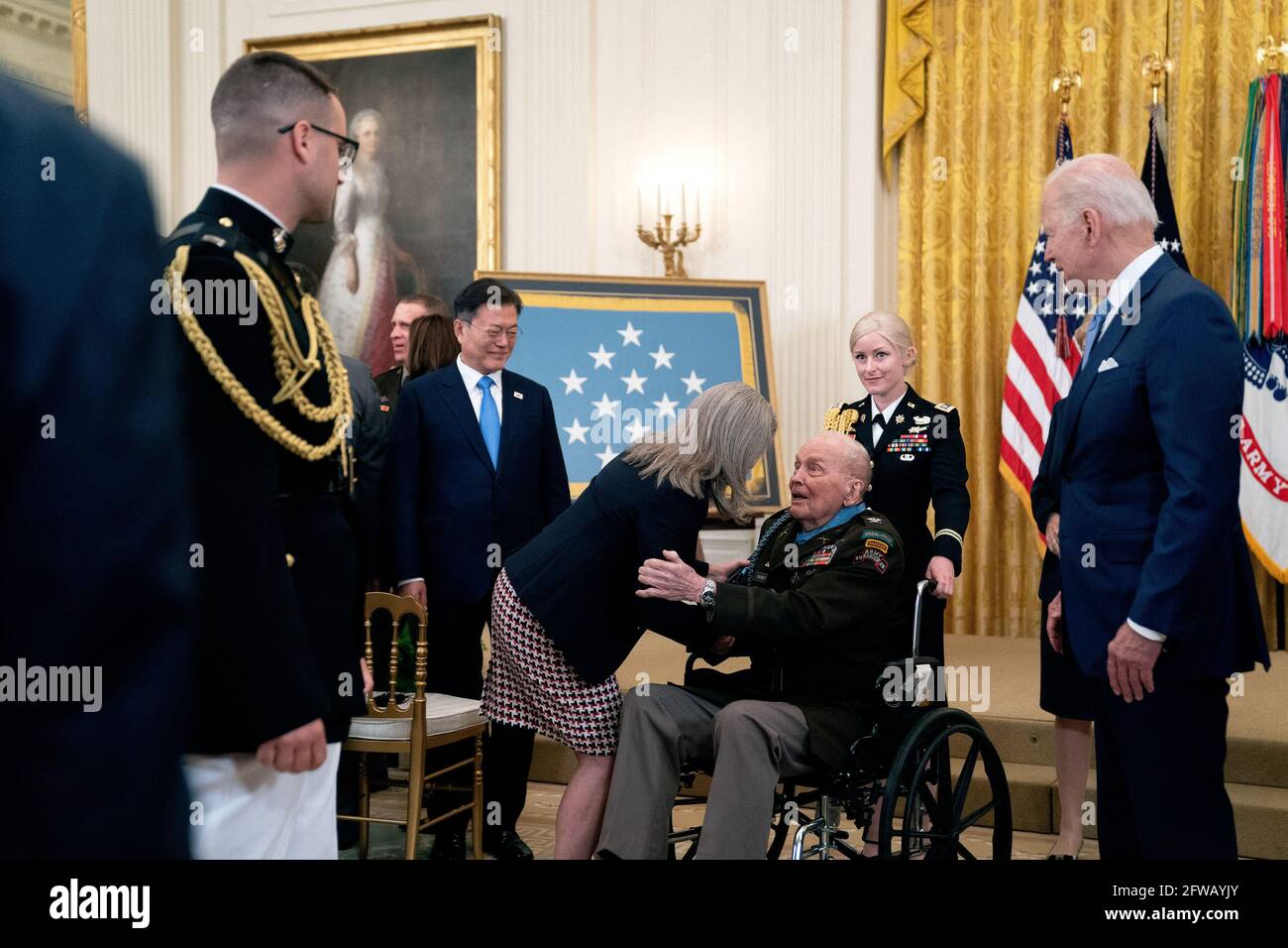 Army Colonel Ralph Puckett hugs Senator Joni Ernst, a republican from ...