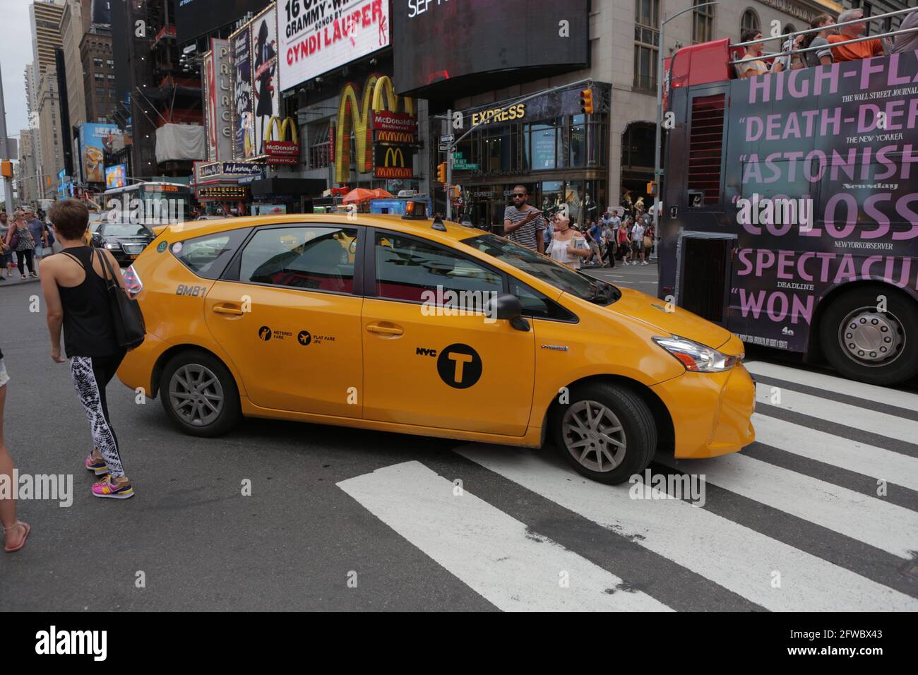 New York City, NY, USA 2.09.2020 - Yellow cab, bus and tourists in ...