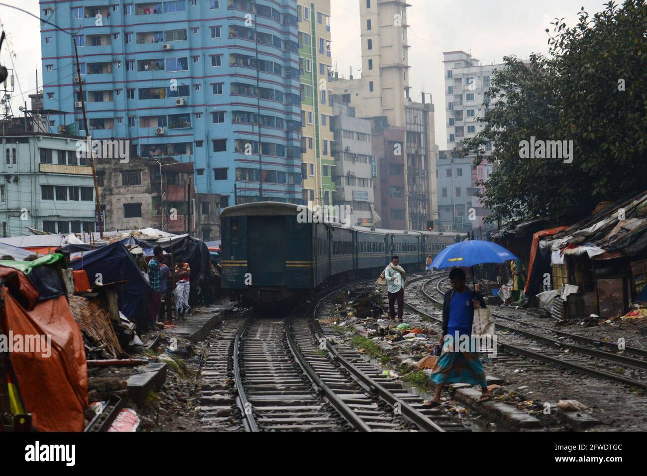 Poor Bangladeshis living by the railway track in the Karwan ...