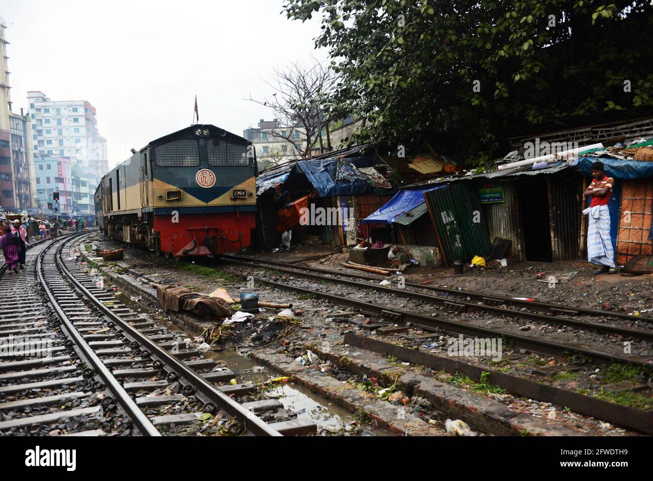 Poor Bangladeshis living by the railway track in the Karwan ...