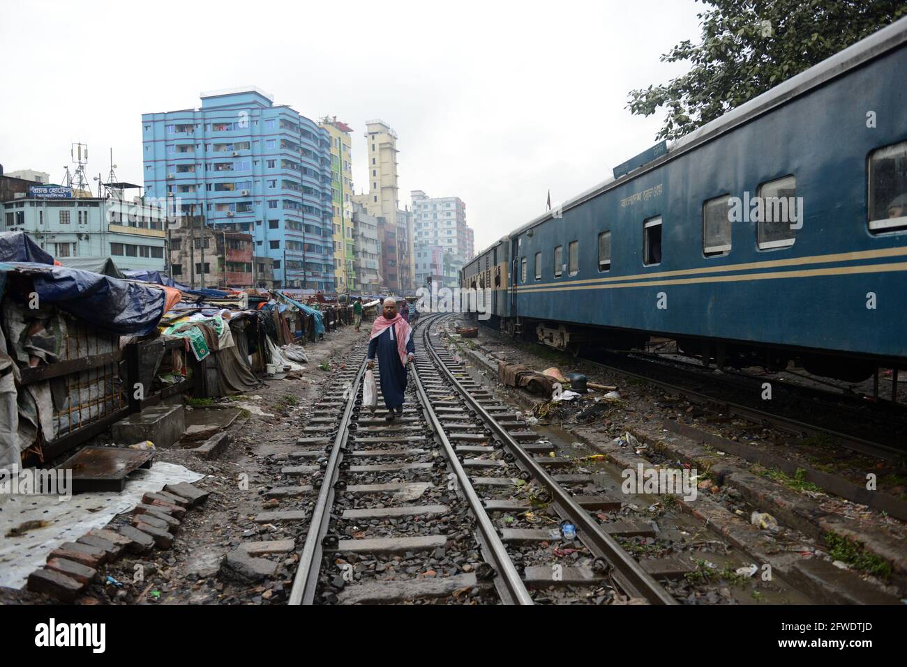 Poor Bangladeshis living by the railway track in the Karwan ...