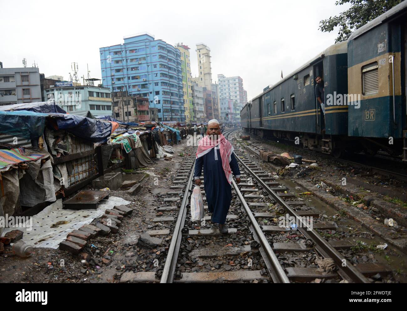 Poor Bangladeshis living by the railway track in the Karwan ...