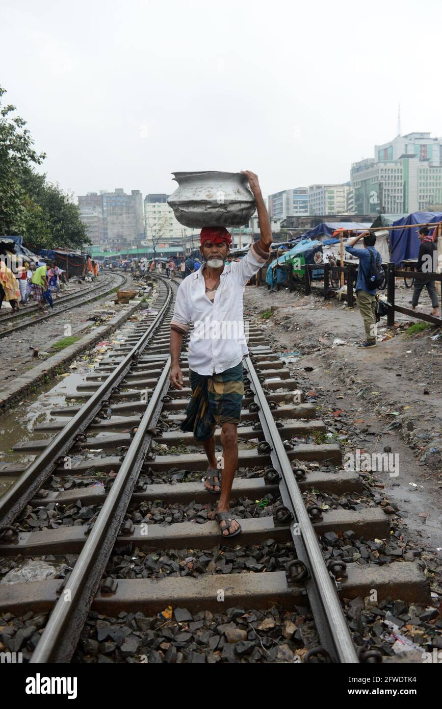 Poor Bangladeshis living by the railway track in the Karwan ...