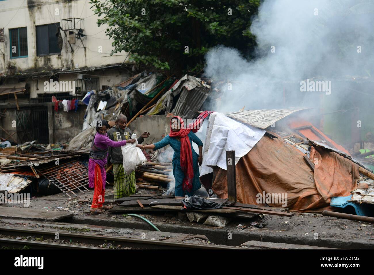 Poor Bangladeshis living by the railway track in the Karwan ...