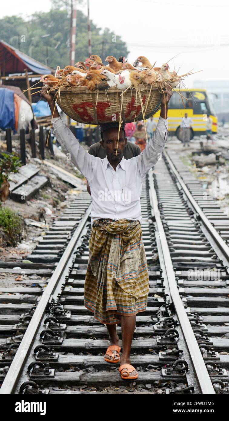 Poor Bangladeshis living by the railway track in the Karwan ...