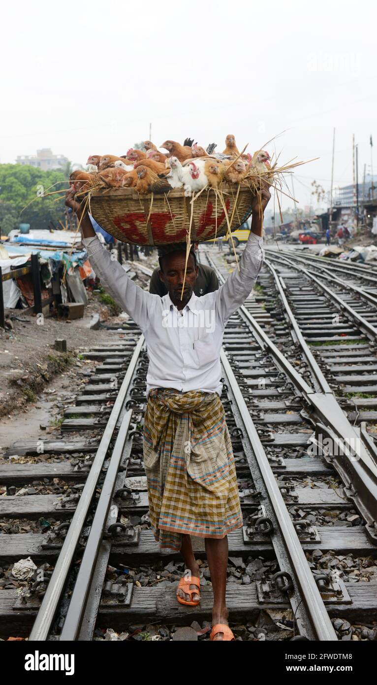 Poor Bangladeshis living by the railway track in the Karwan ...