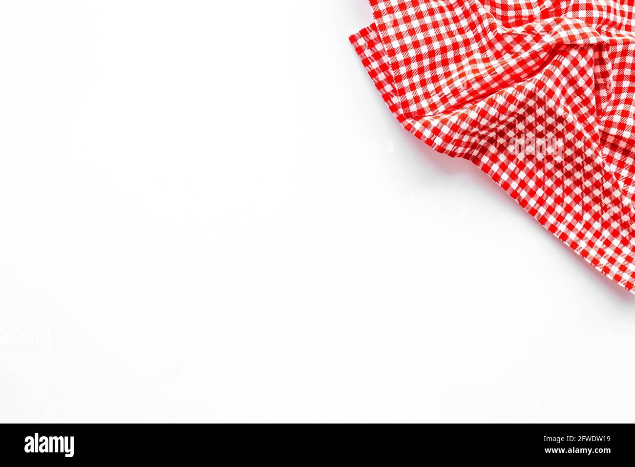 Red picnic cloth isolated on white, top view Stock Photo - Alamy