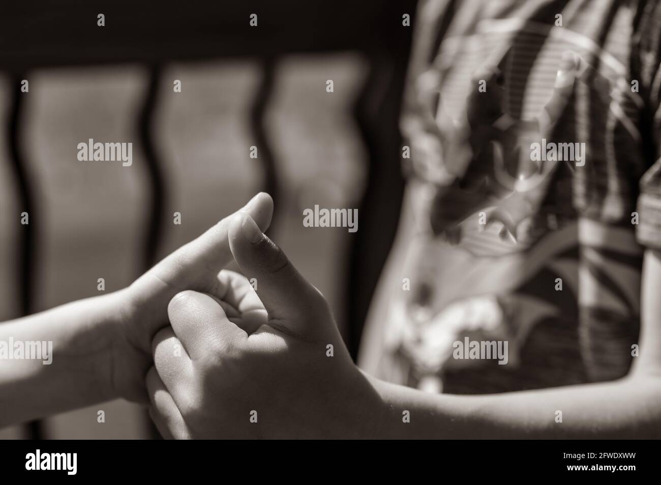 Childhood simulated wrestling by two hand grasping and using thumbs to ...