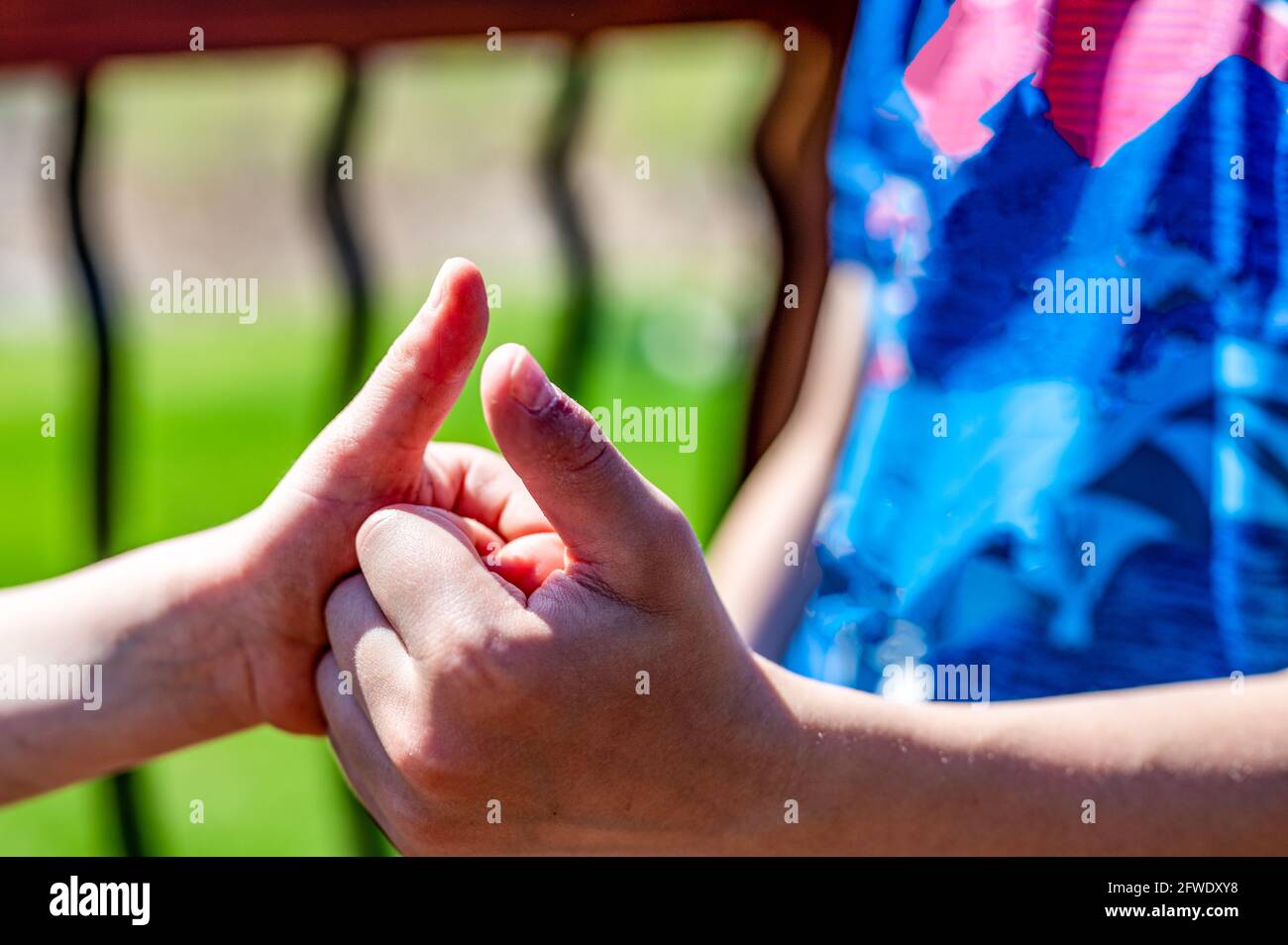 Childhood simulated wrestling by two hand grasping and using thumbs to ...