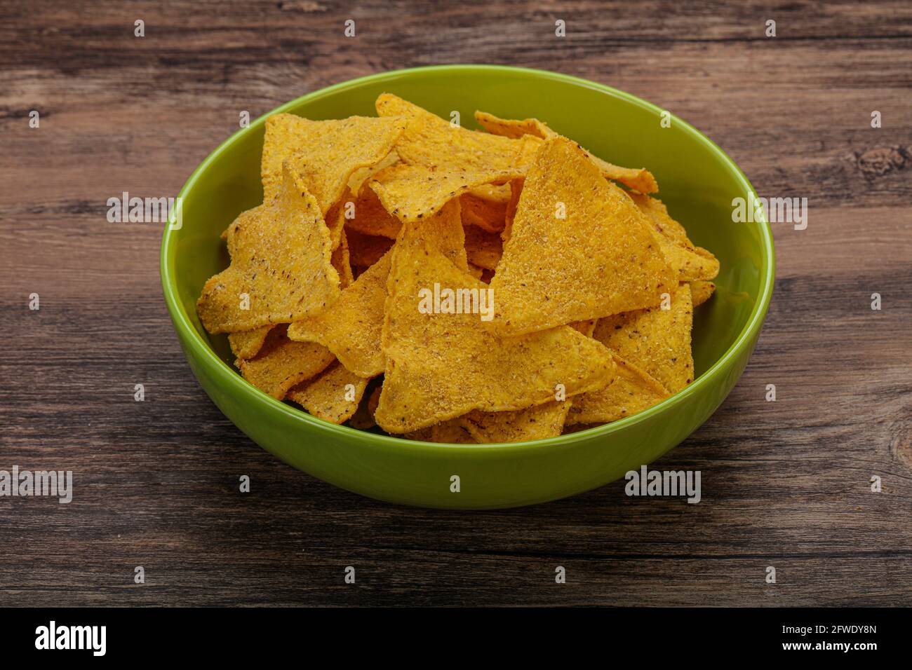 Mexican crunchy corn nachos triangle heap Stock Photo - Alamy