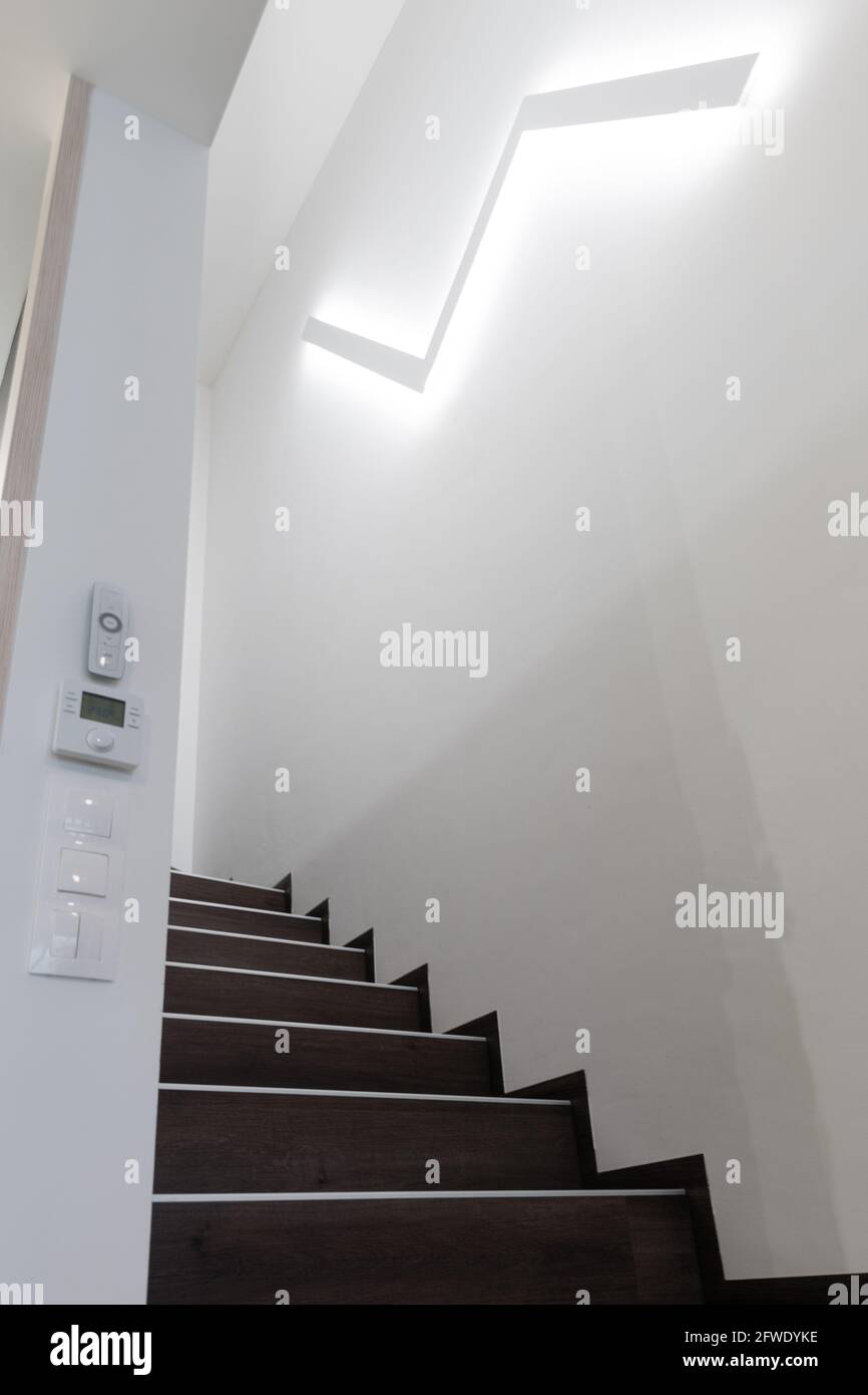 Brown stairway in contemporary apartment Stock Photo - Alamy