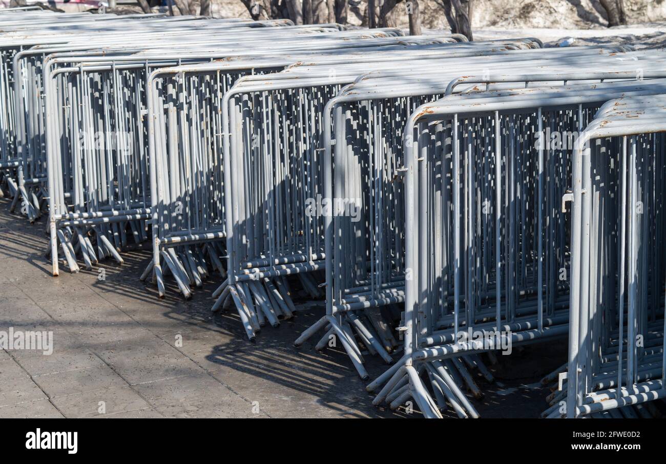 metal modules of mobile street fencing arranged in rows Stock Photo - Alamy