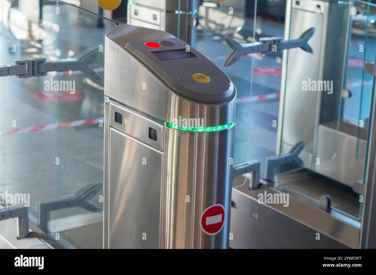 Turnstile for entry and exit with tickets Stock Photo - Alamy