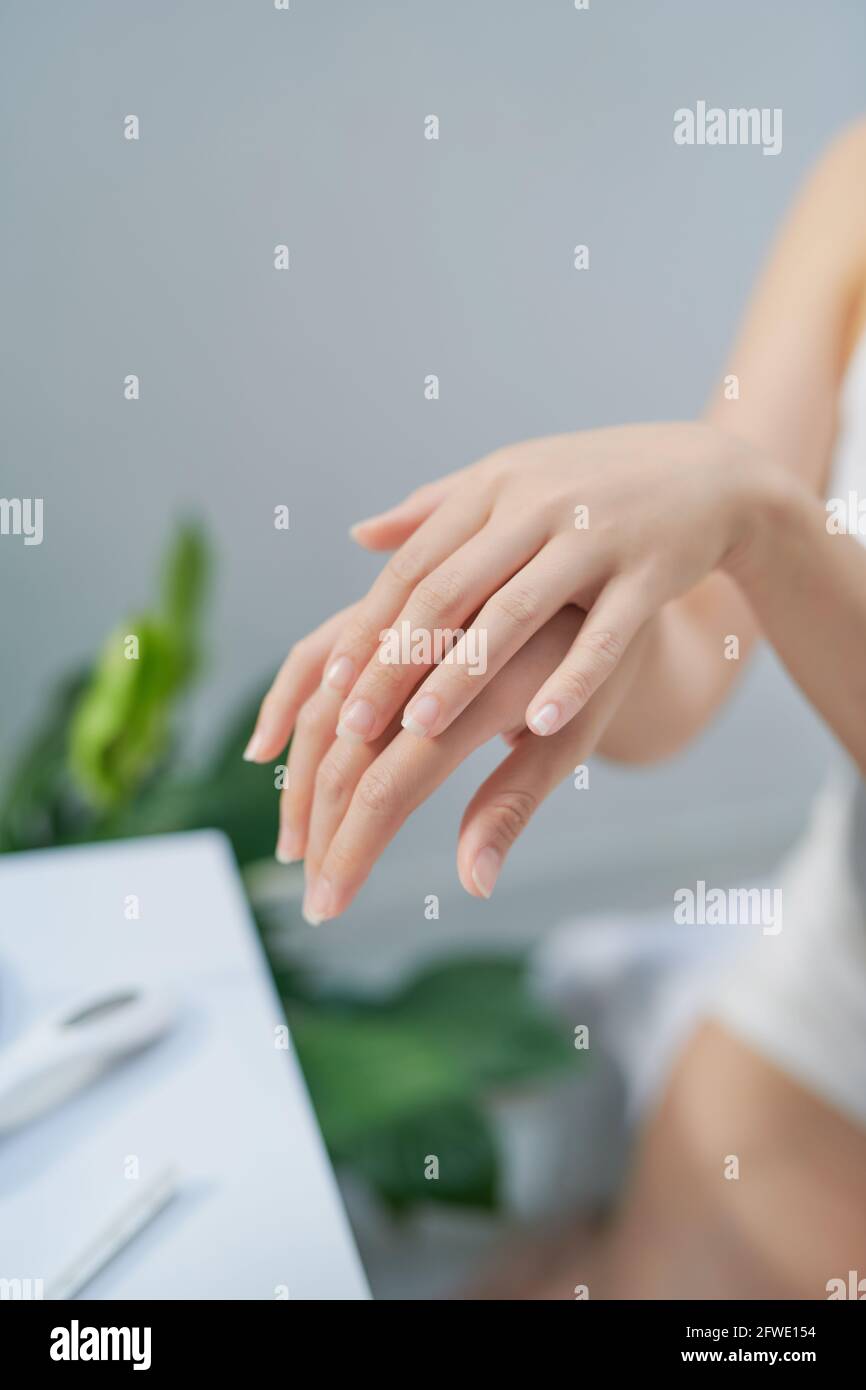 Putting on lotion hi-res stock photography and images - Alamy