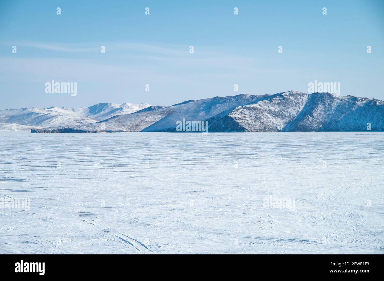Rocky cliff at Lake Baikal in winter. Christmas snow background Stock ...