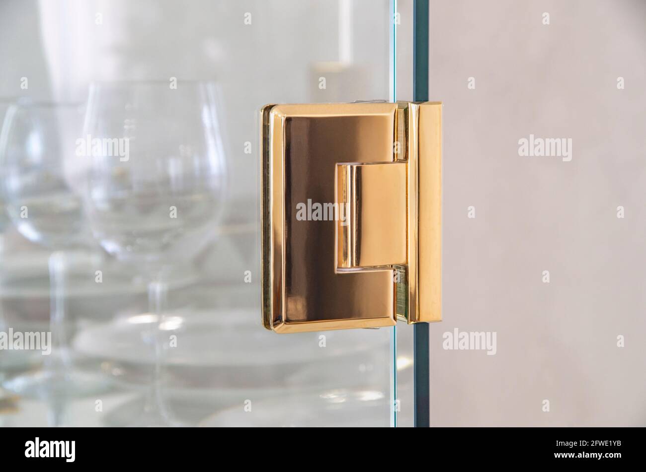 Golden hinge for glass showcase close up Stock Photo - Alamy
