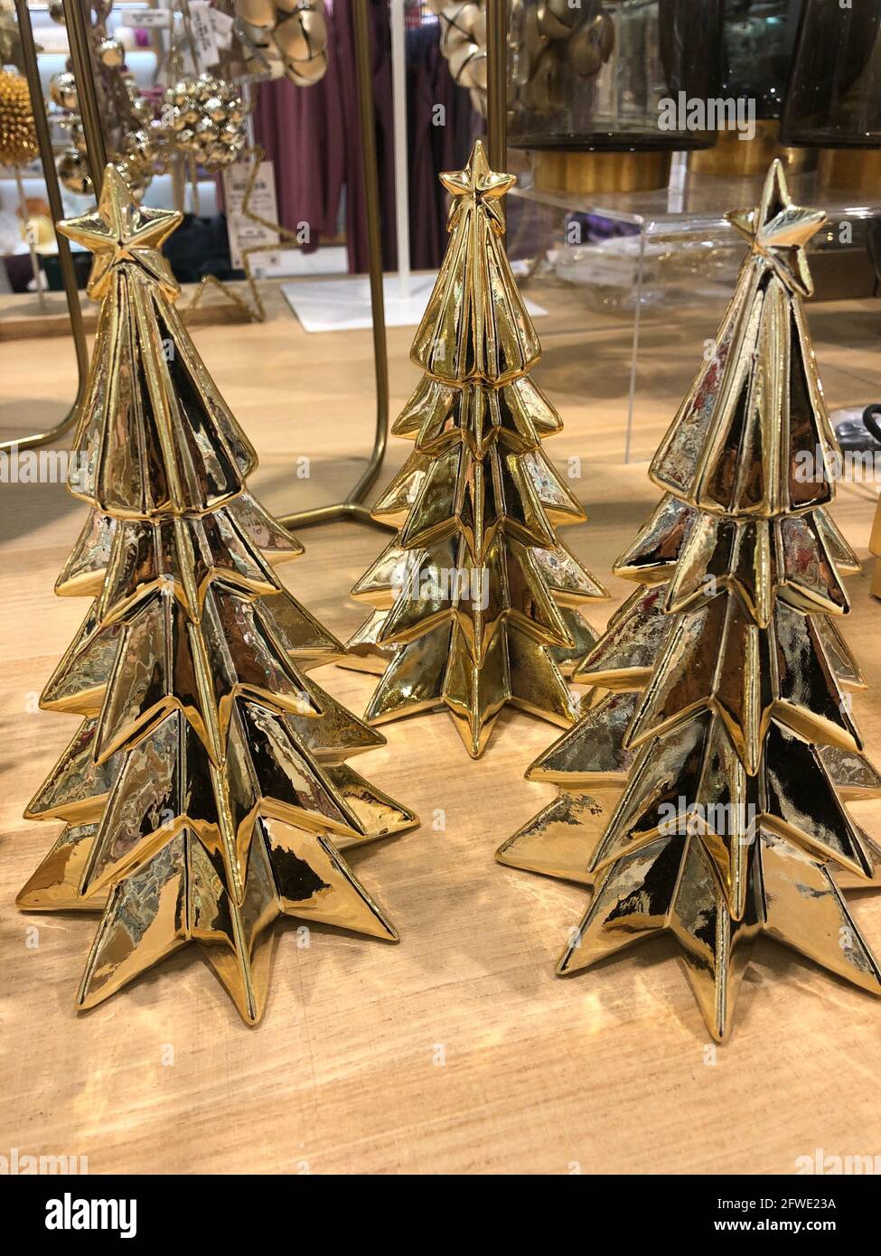 Three golden Christmas trees isolated on white background Stock Photo ...
